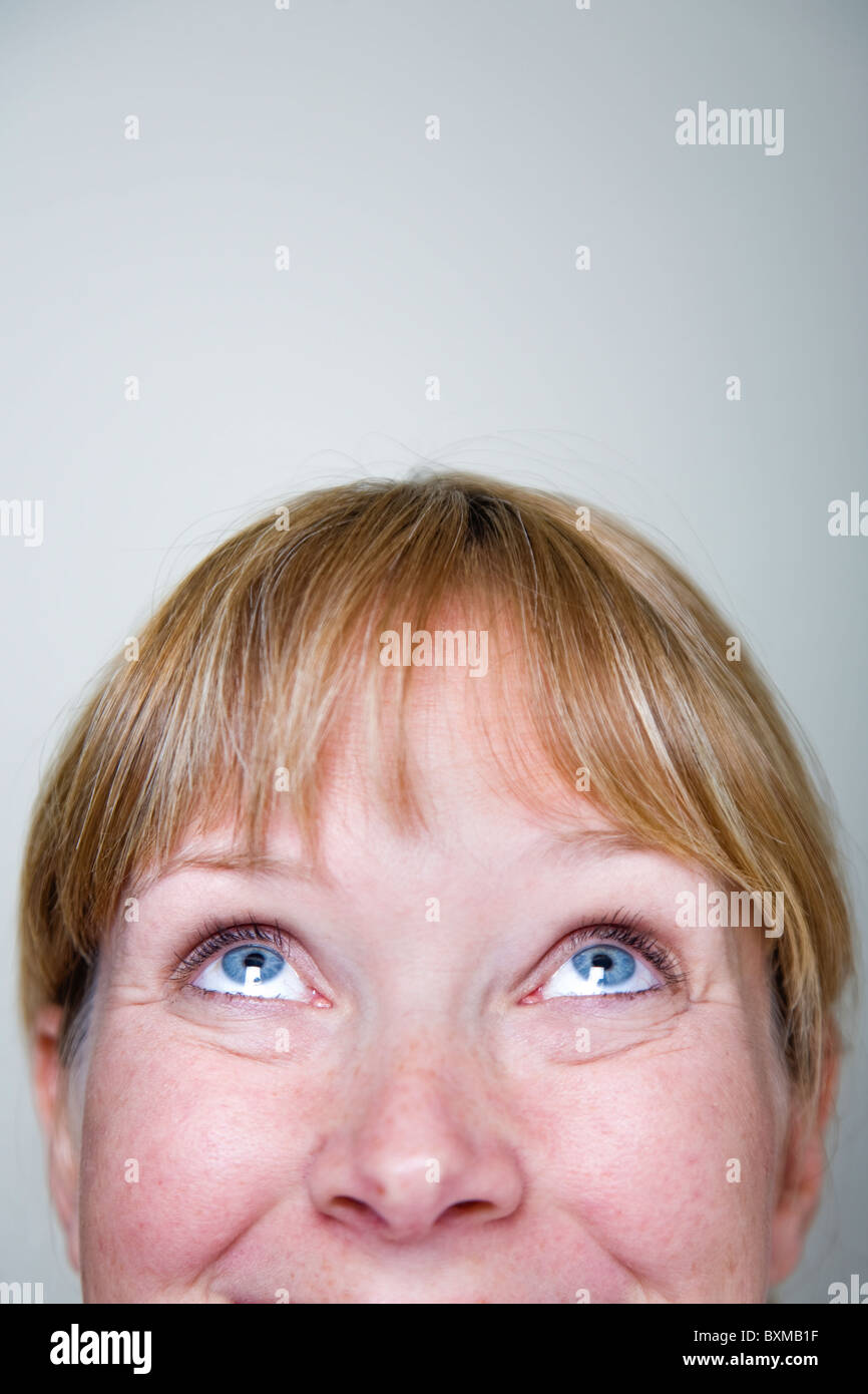 Portrait of a woman looking up Stock Photo - Alamy