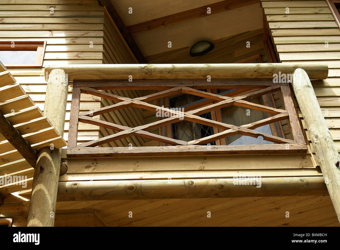 Balcony with handrail of wood, foreground to highlight the wood and the ...