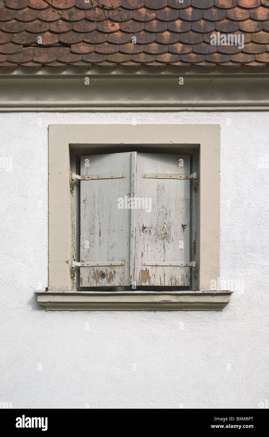 Aging and Weathered Window with Shutters on a House in Germany Stock ...