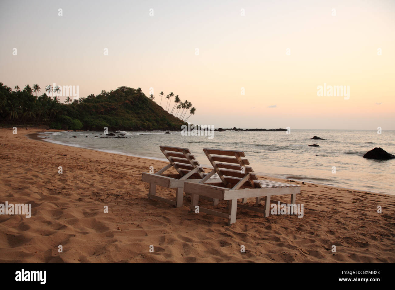 Sunbeds on the beach at sunset, Cola Beach, Goa, India Stock Photo - Alamy