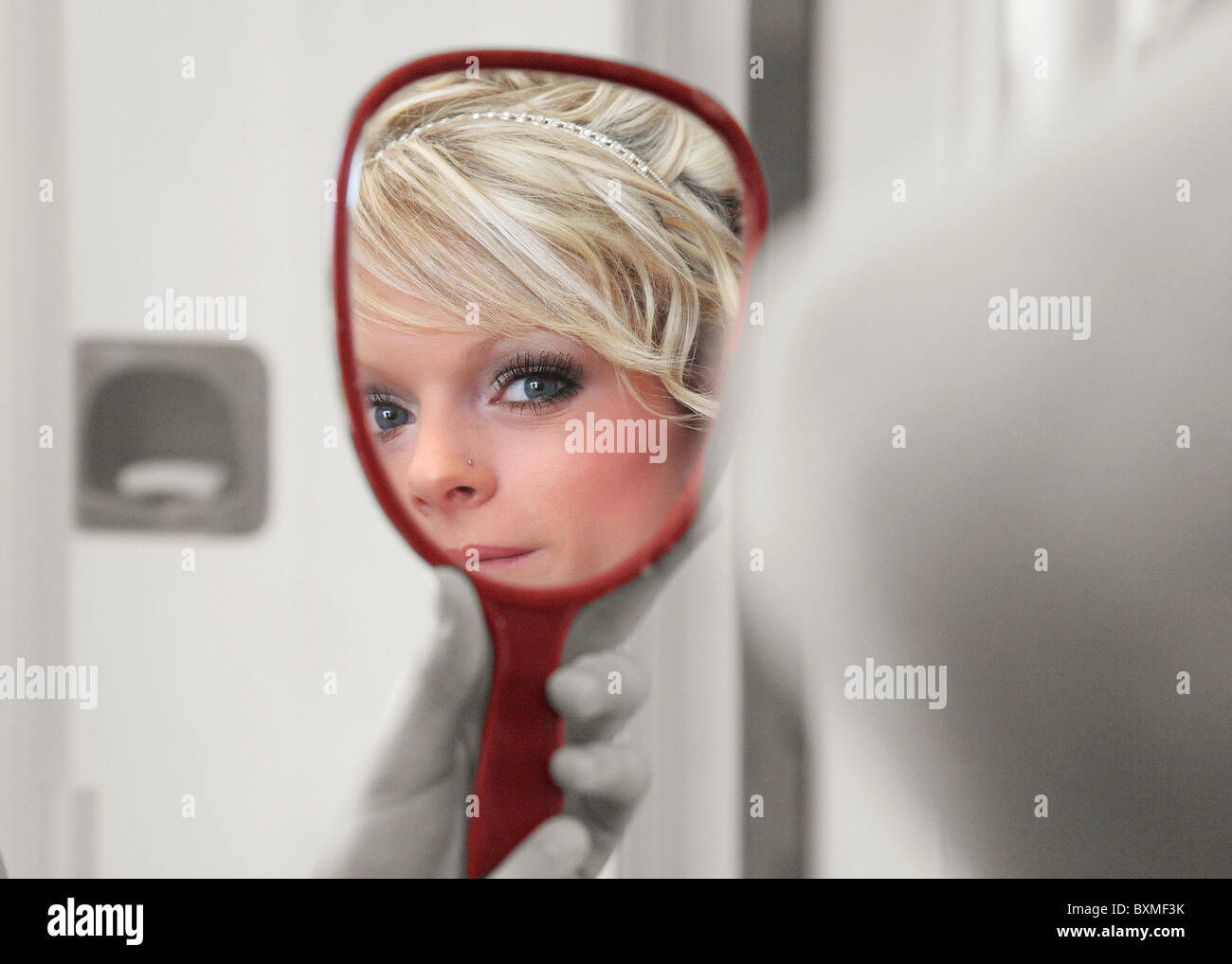 selective coloring bride reflected in mirror preparing for ceremony ...