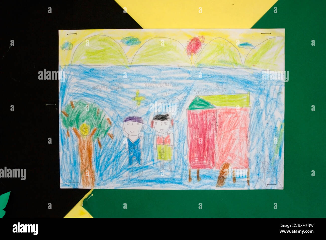 A colorful color crayon art drawing by a child student decorates the ...