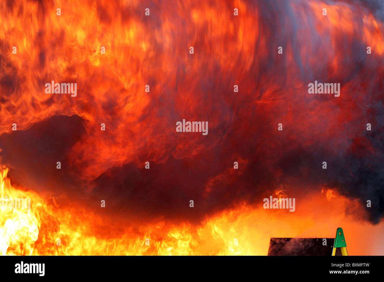 A room on fire with a childs toy in the flames Stock Photo - Alamy