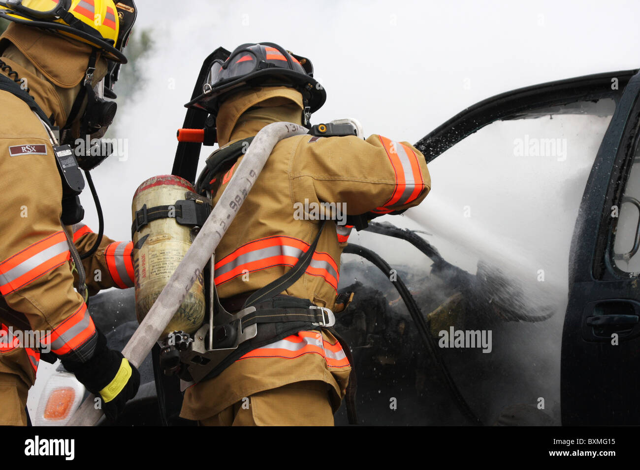 Fire truck hose fighting fire hi-res stock photography and images - Alamy