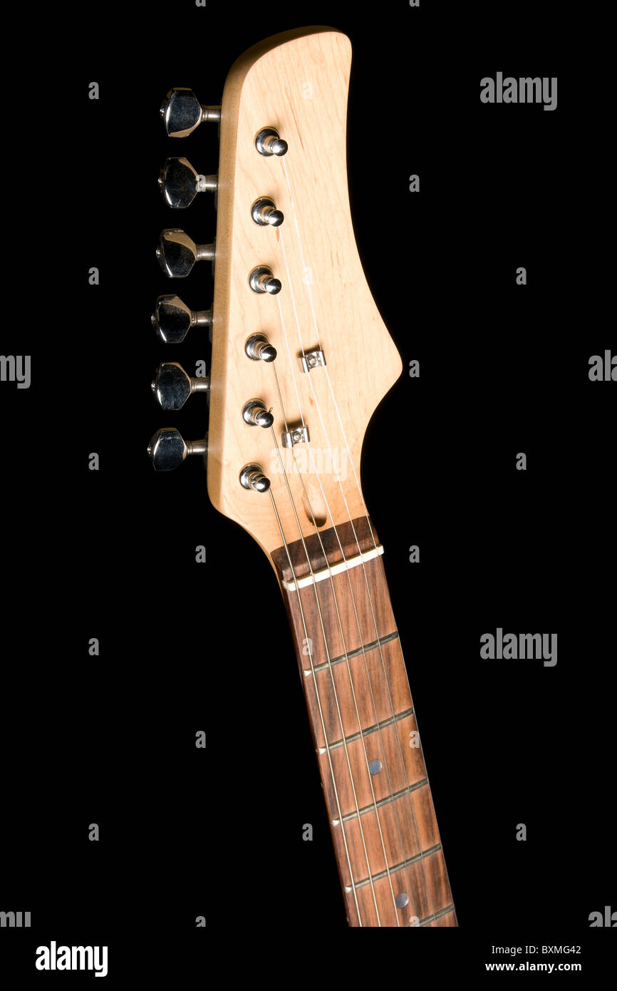 Electric guitar neck close-up isolated on black Stock Photo - Alamy