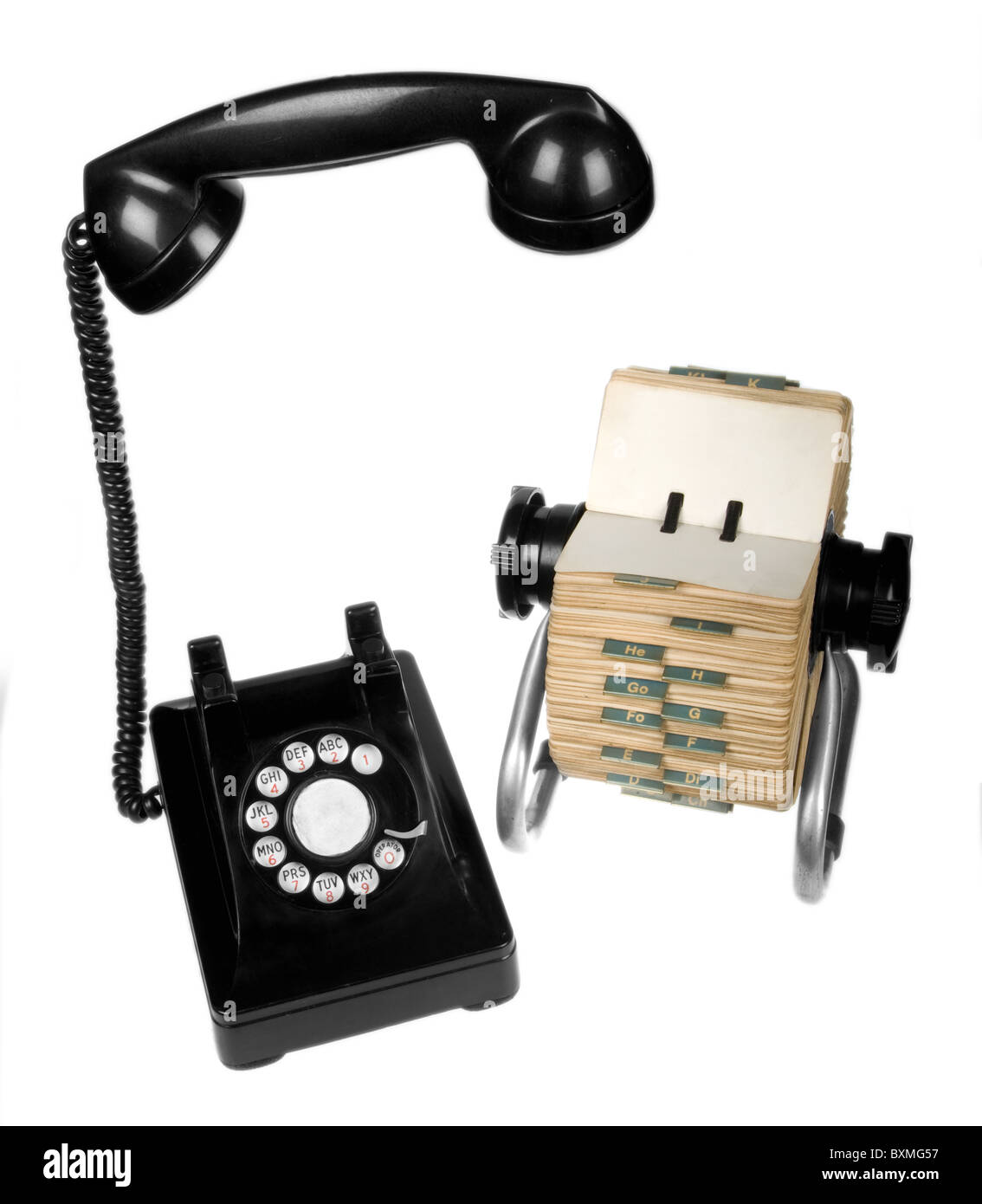 Set of vintage retro rotary telephone and rotary card file on white ...