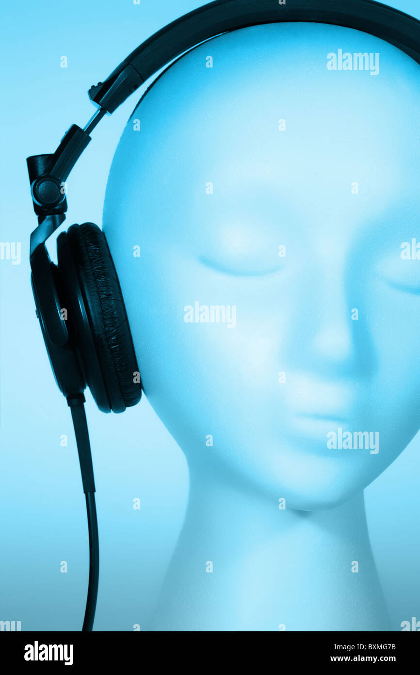 Female mannequin head listening to music with blue overlay Stock Photo ...