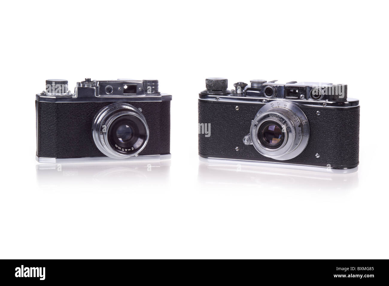 Two vintage pocket rangefinder film cameras isolated on white ...