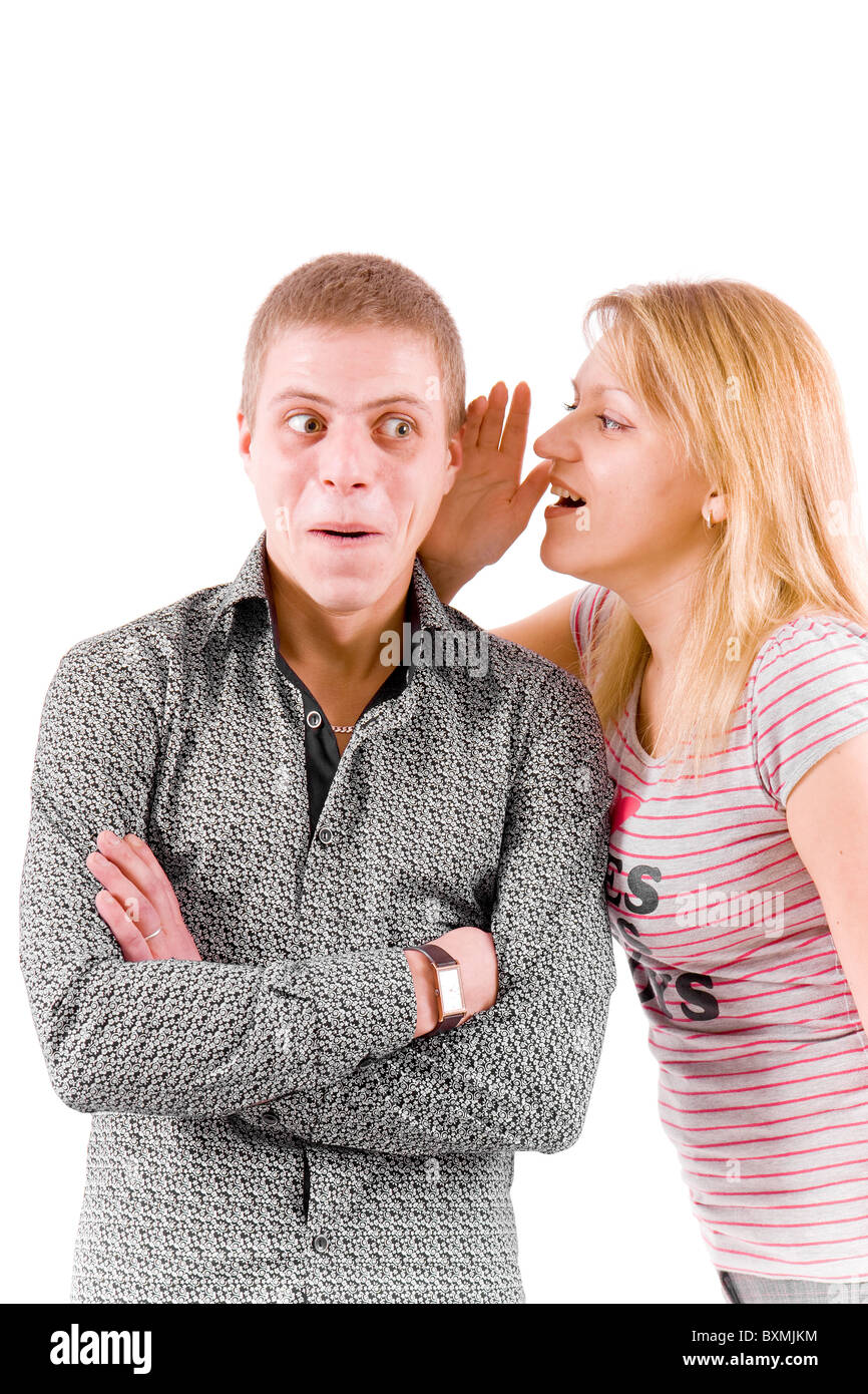 The girl silently tells something to the young man Stock Photo - Alamy