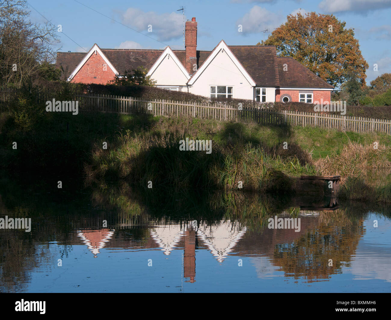 Houses next to canal or river Stock Photo - Alamy