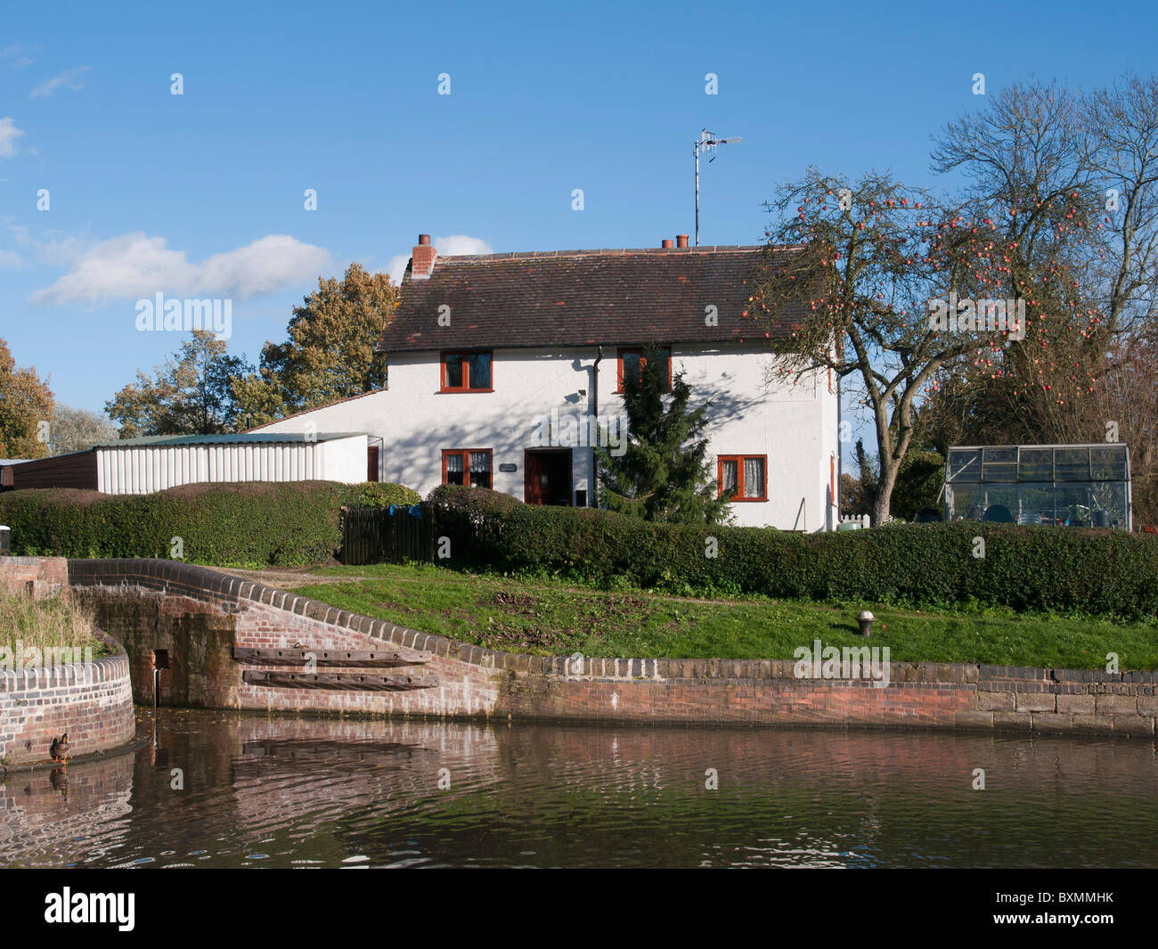 Houses next to canal or river Stock Photo - Alamy