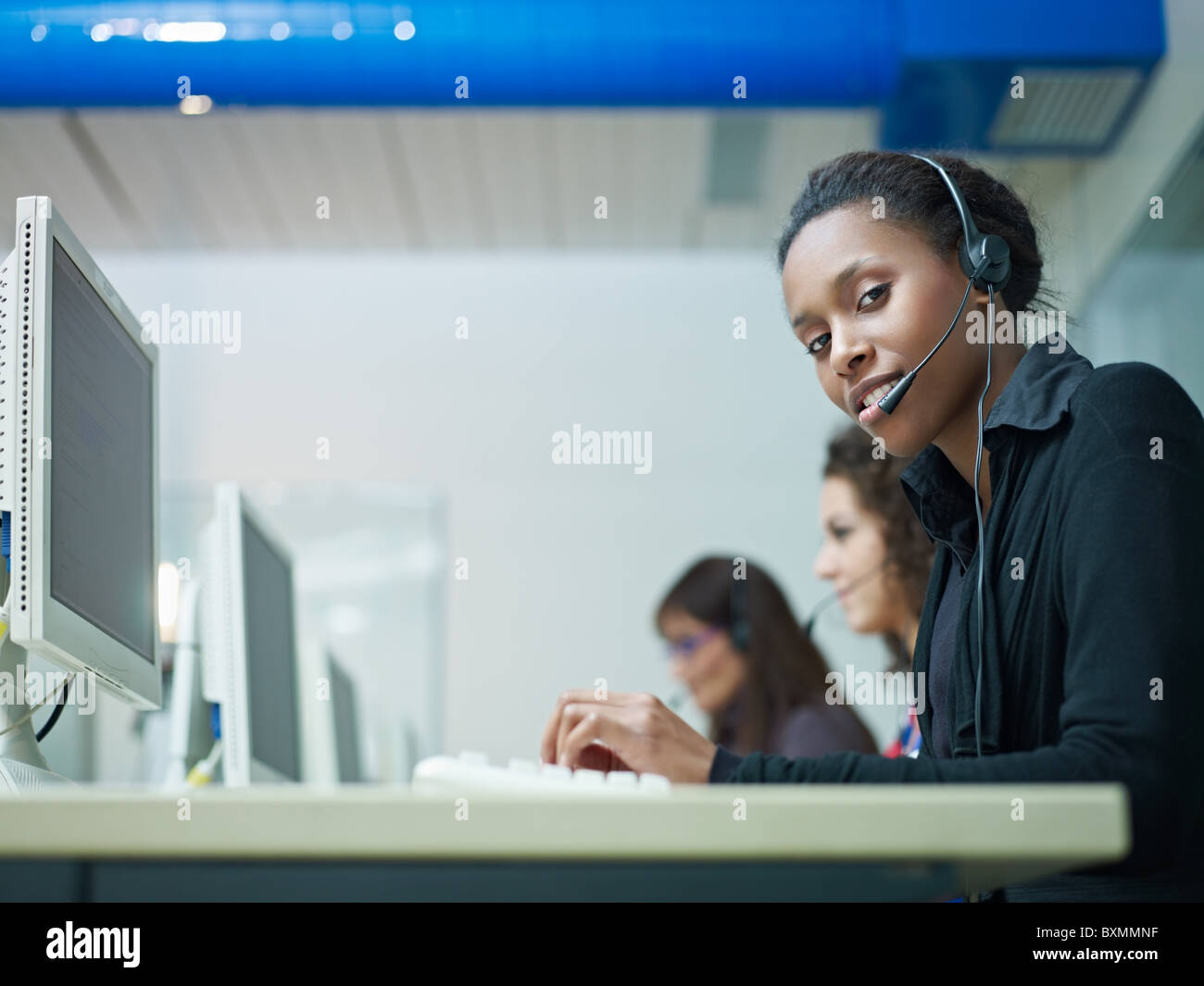 multiethnic group of female customer service representatives talking on ...