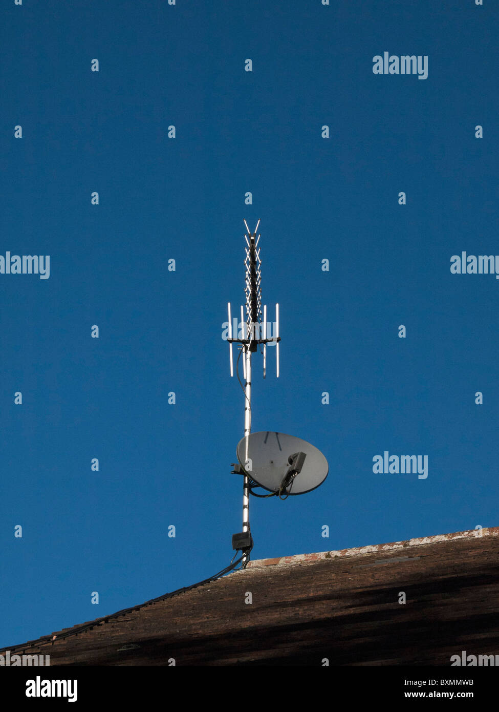 A satellite digital television arial on a roof Stock Photo - Alamy