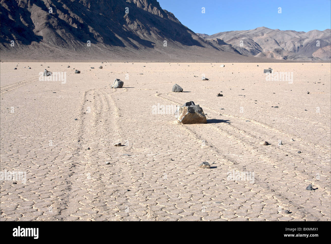 Trails created by moving rocks on the Racetrack Playa in Death Valley ...