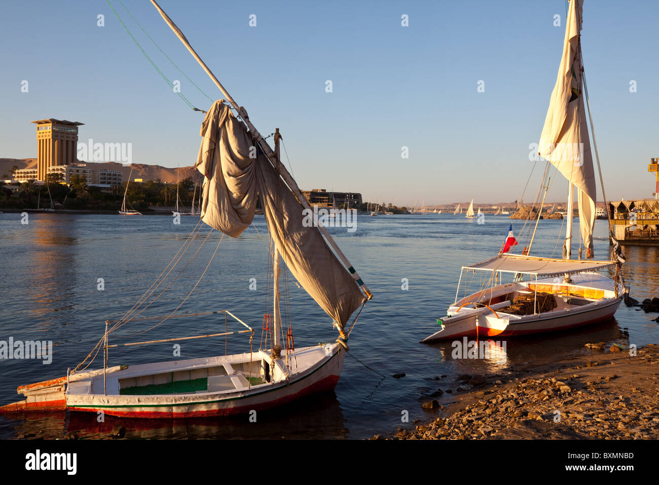 Feluke on Nile river in Aswan city, Egypt at the sunset Stock Photo - Alamy