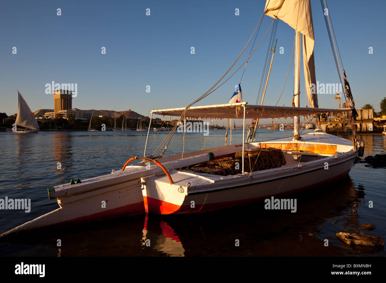 Feluke on Nile river in Aswan city, Egypt at the sunset Stock Photo - Alamy