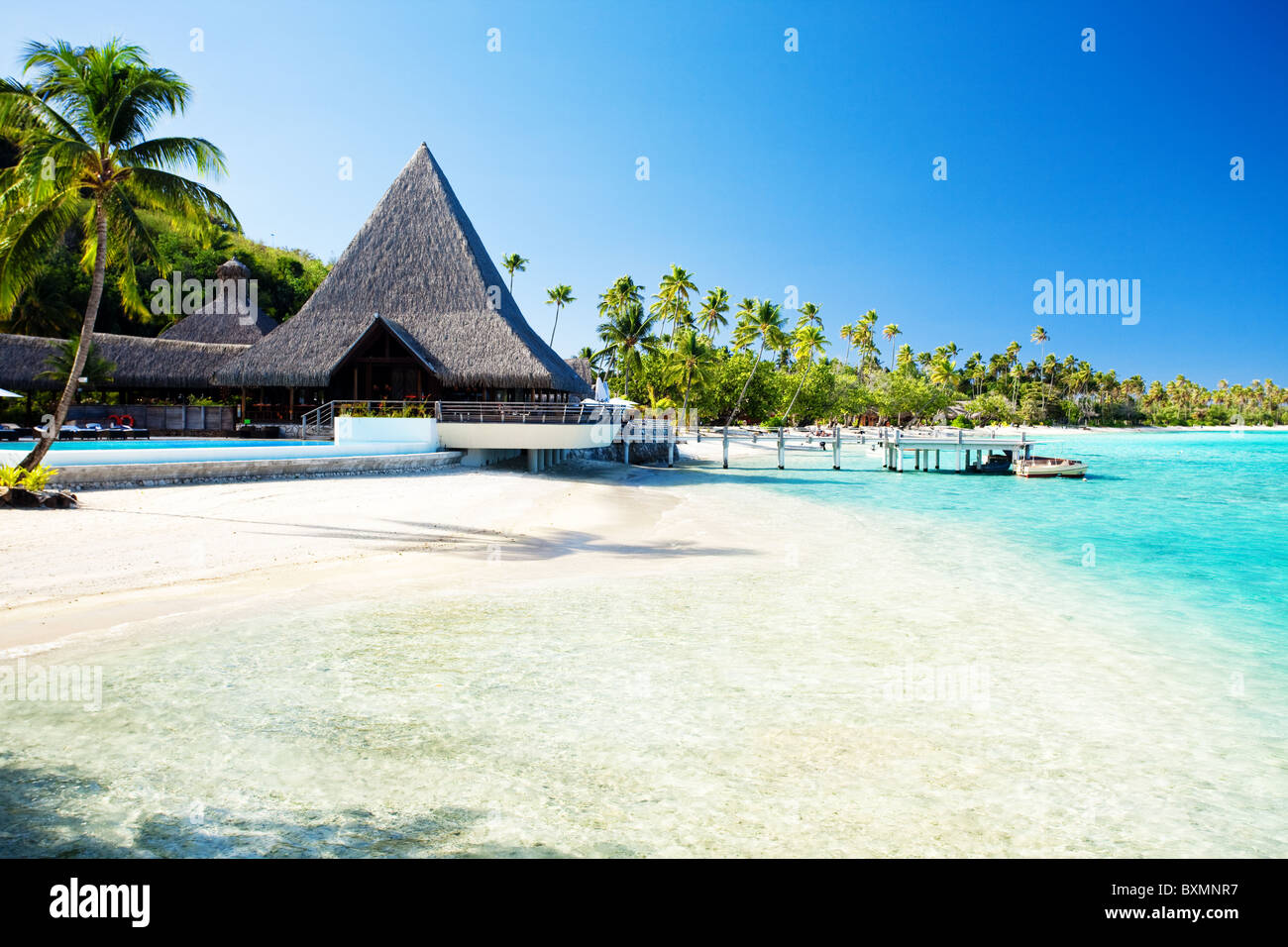 Little jetty and boat on tropical beach with amazing water Stock Photo ...