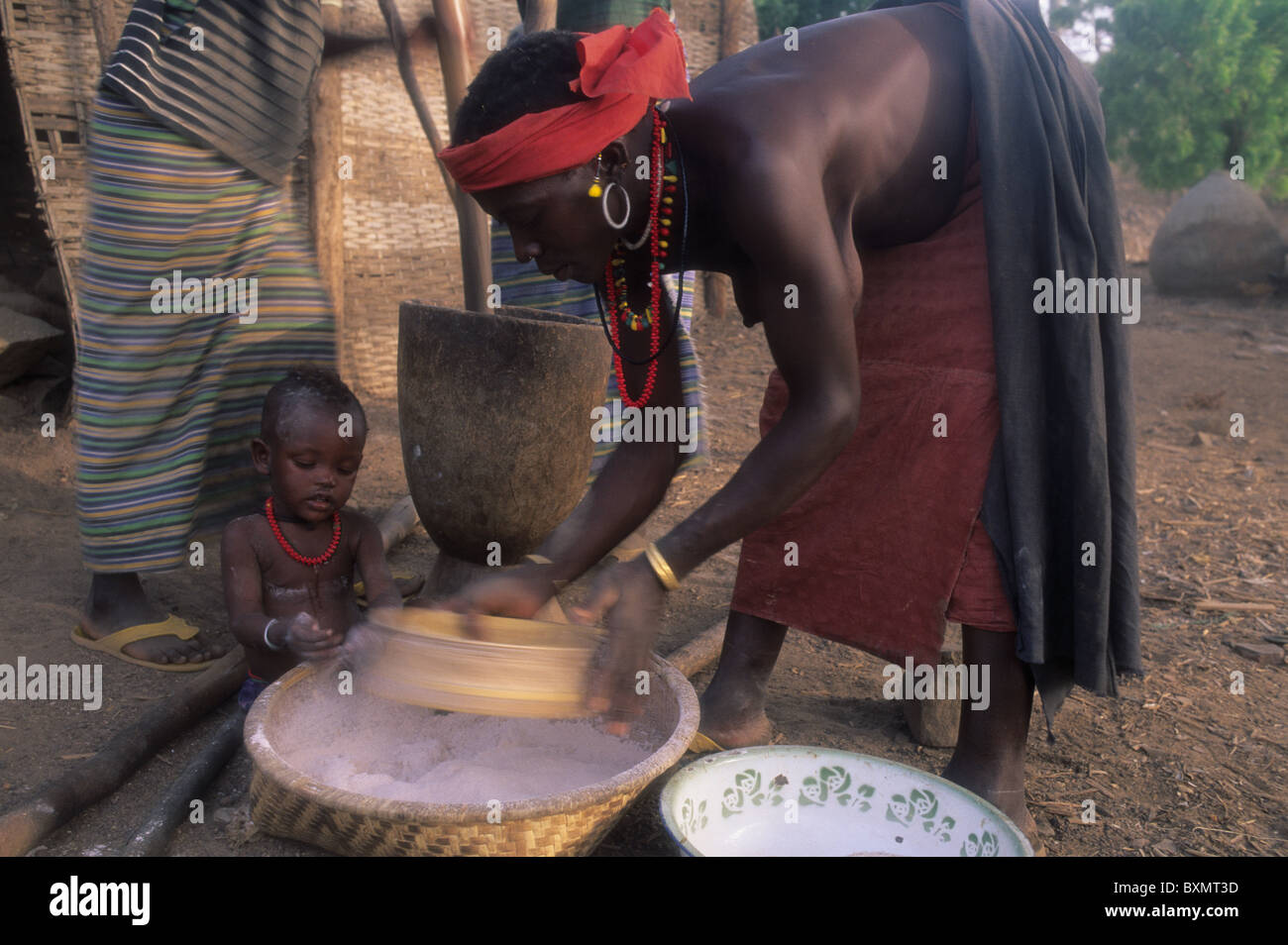 Bedik women grinding millet. " Village of Iwol " Bassari COUNTRY ...