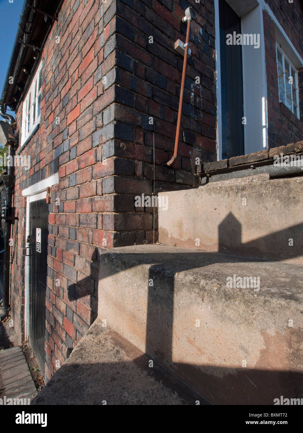 A very small house with storeroom attached Stock Photo - Alamy