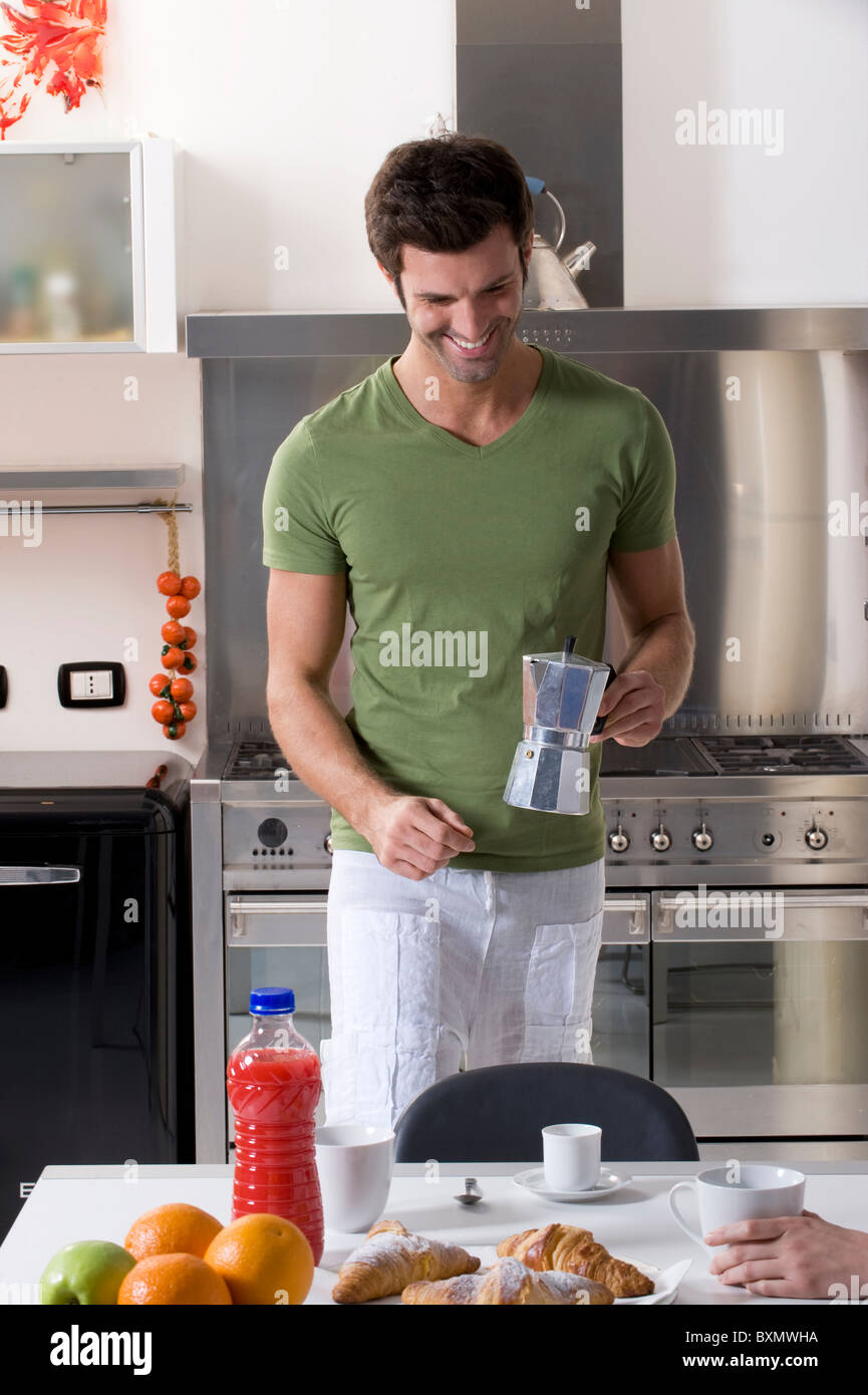 man in the kitchen preparing breakfast Stock Photo - Alamy