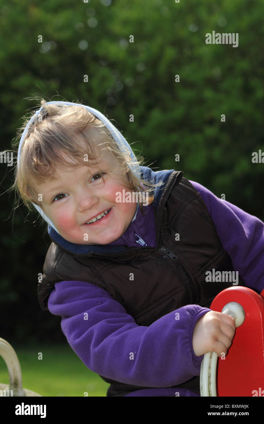 Girl on teeter totter hi-res stock photography and images - Alamy