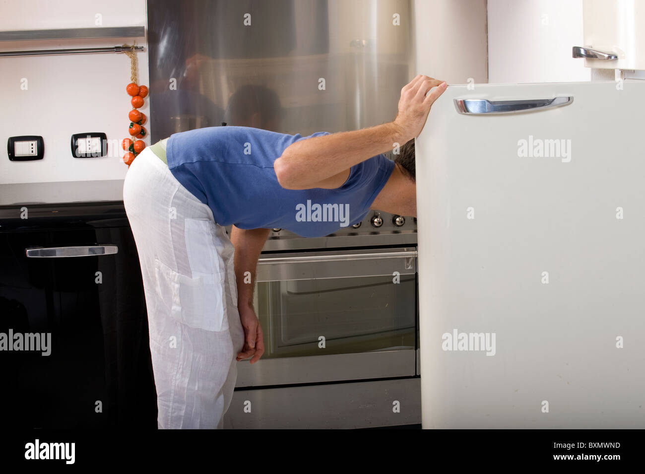Man opening refrigerator hi-res stock photography and images - Alamy