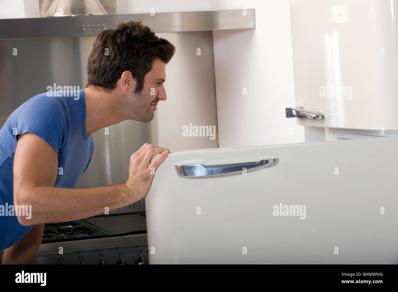 Man opening refrigerator hi-res stock photography and images - Alamy
