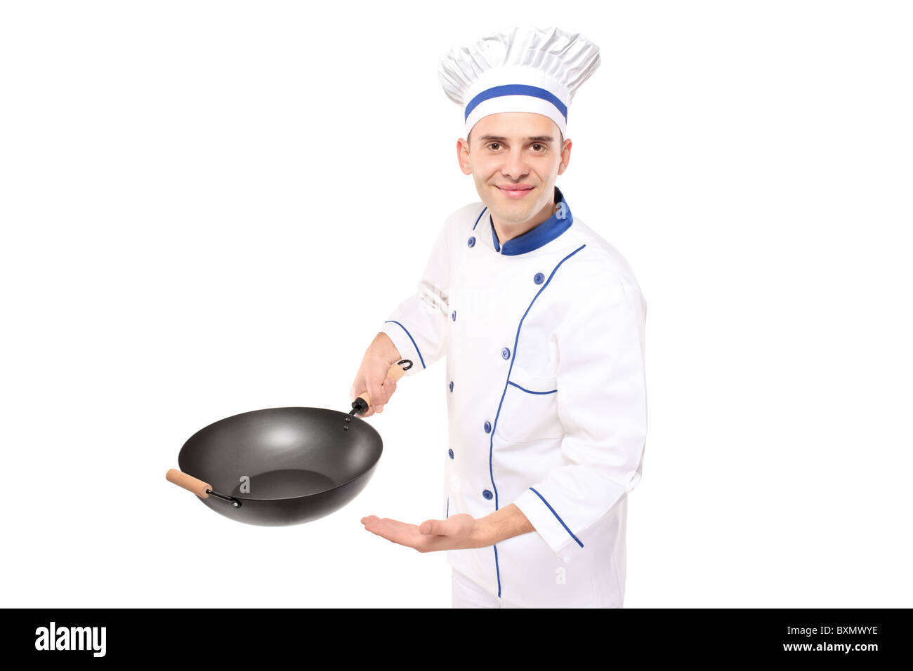 A chef holding a wok welcoming Stock Photo - Alamy