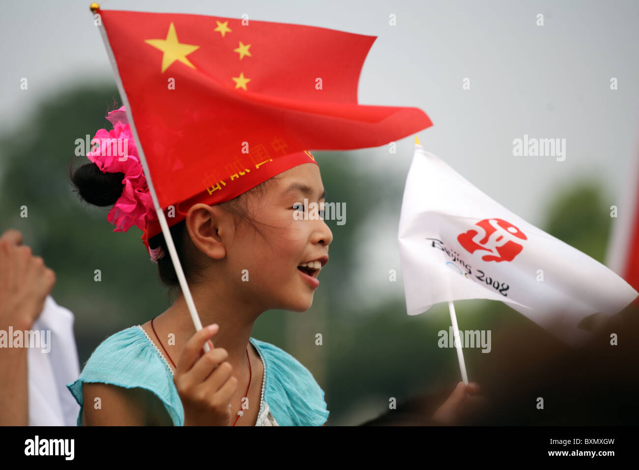 Chinese girl waving national flag, Pre-Olympic Games Parade, Beijing ...