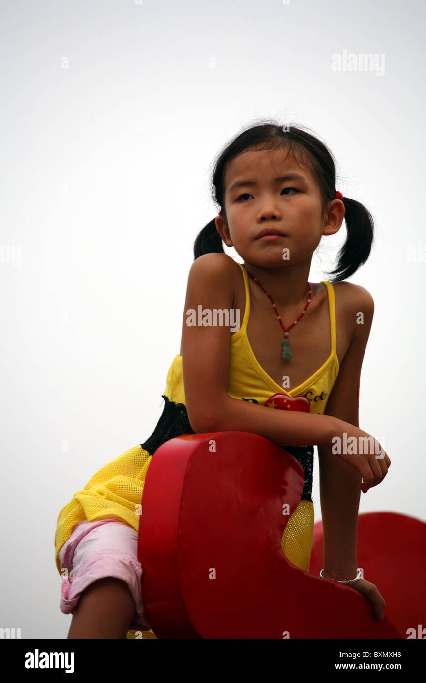 Chinese girl obtaining higher view, Pre-Olympic Games Parade, Beijing ...