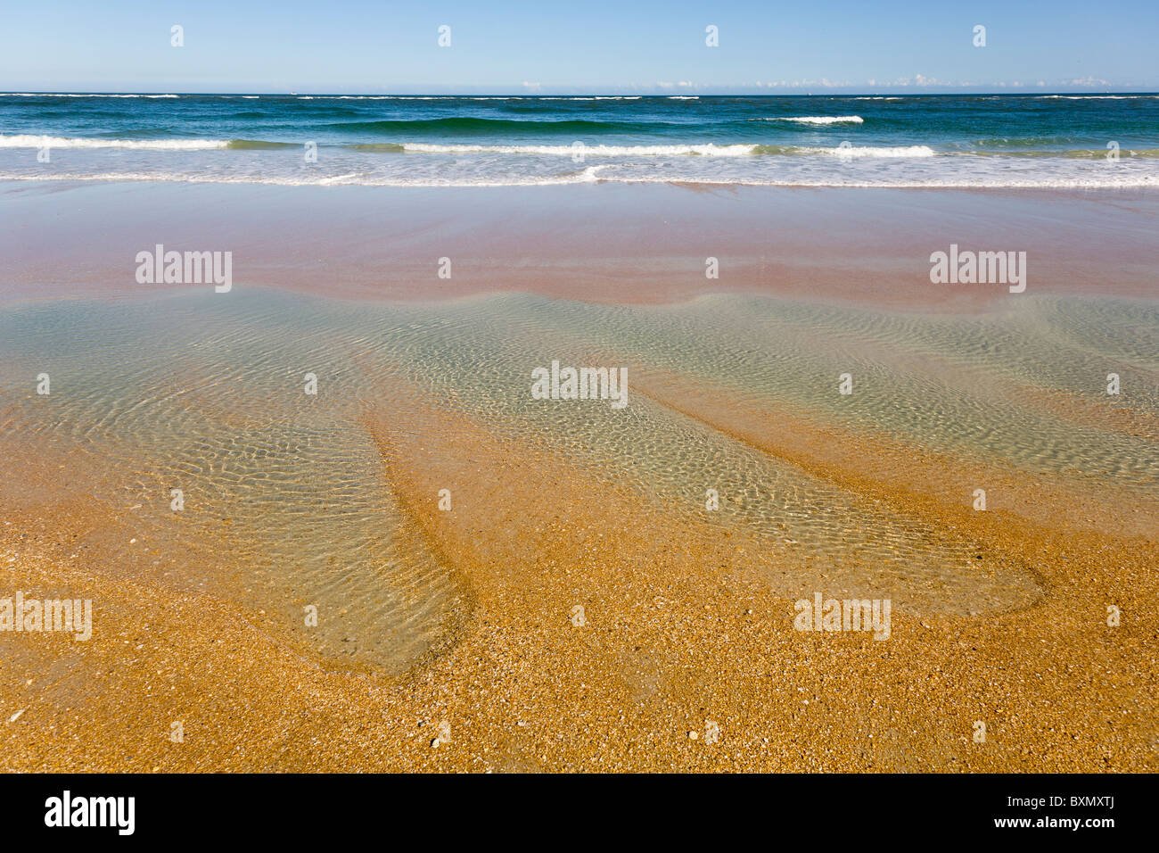Abstract closeup of agua colored shallow pools of water on beach at ...