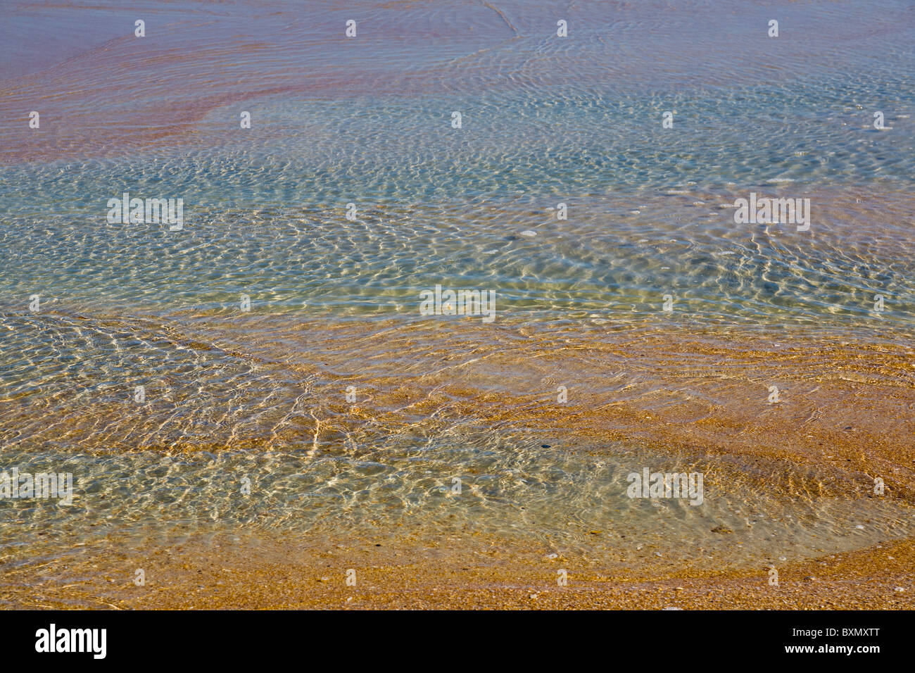 Abstract closeup of agua colored shallow pools of water on beach at ...