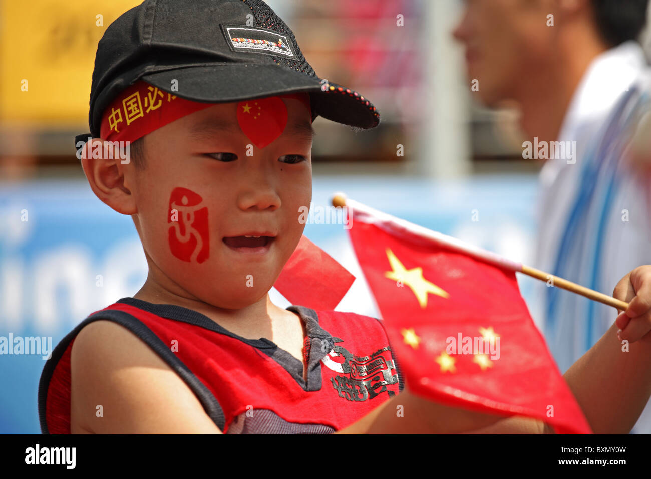 Chinese boy in audience at Beach Volleyball Finals, Olympic Games ...