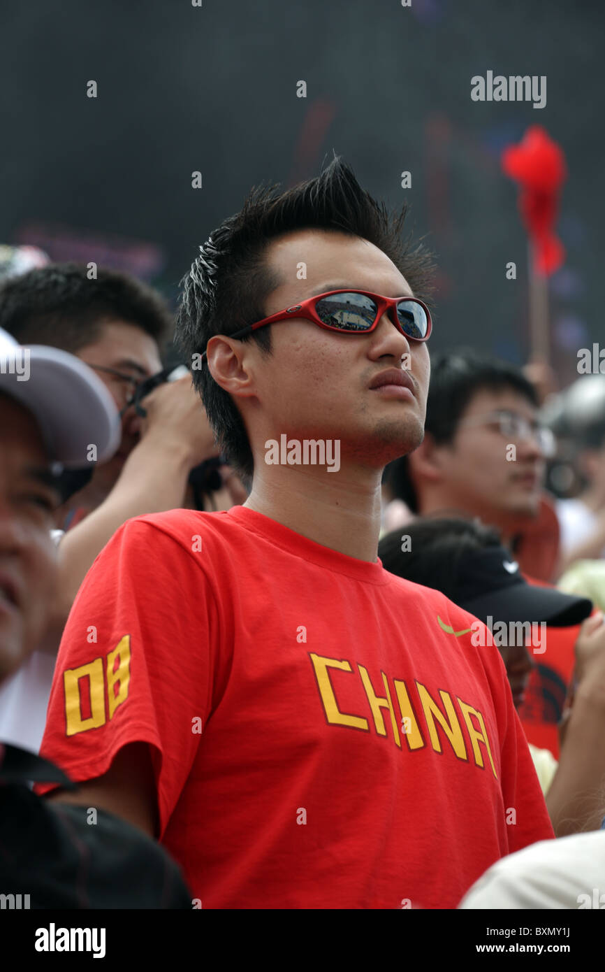 Male spectator at Women's beach volleyball finals, Chaoyang Park ...