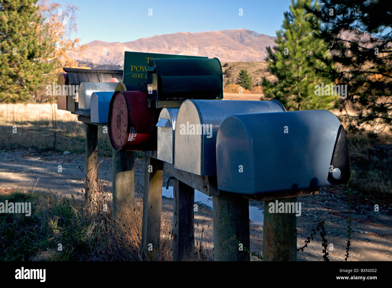 Row of traditional letter boxes on the roadside Stock Photo - Alamy
