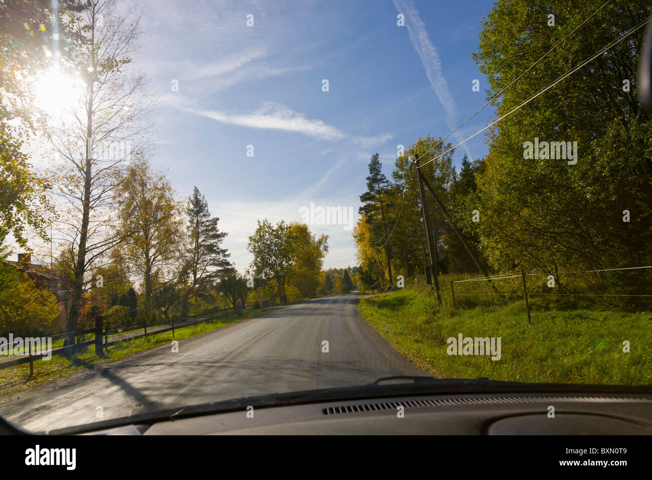 Driving on a small country road in autumn Stock Photo - Alamy