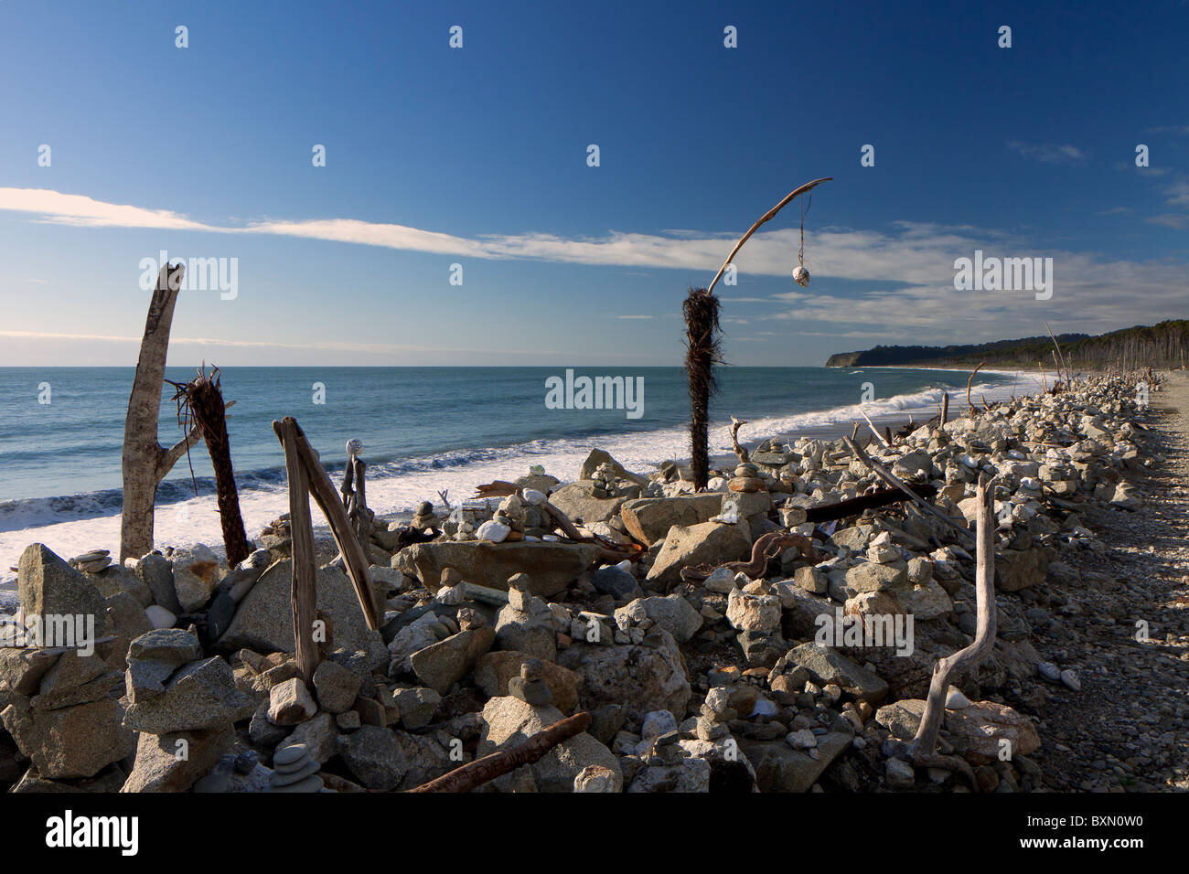 Wierd sculptures amongst the driftwood on a beach in the Haast region ...