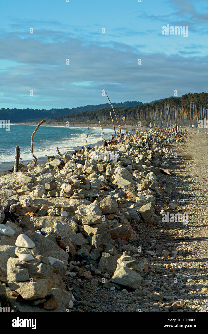 Wierd sculptures amongst the driftwood on a beach in the Haast region ...