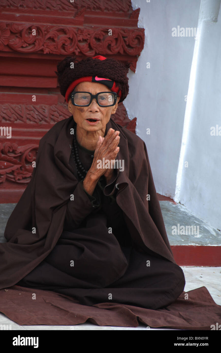 old lady beggar outside temple , The Shwedagon Pagoda , also known as ...