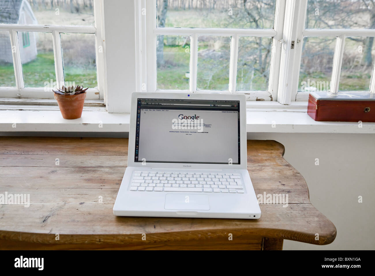 Google on wireless Macbook Stock Photo - Alamy