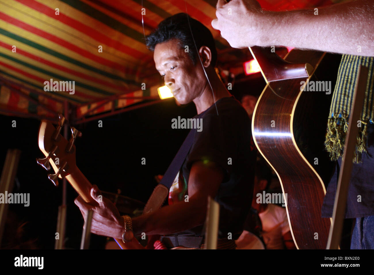 A Khmer bass player performs in Kampot, Cambodia Stock Photo - Alamy