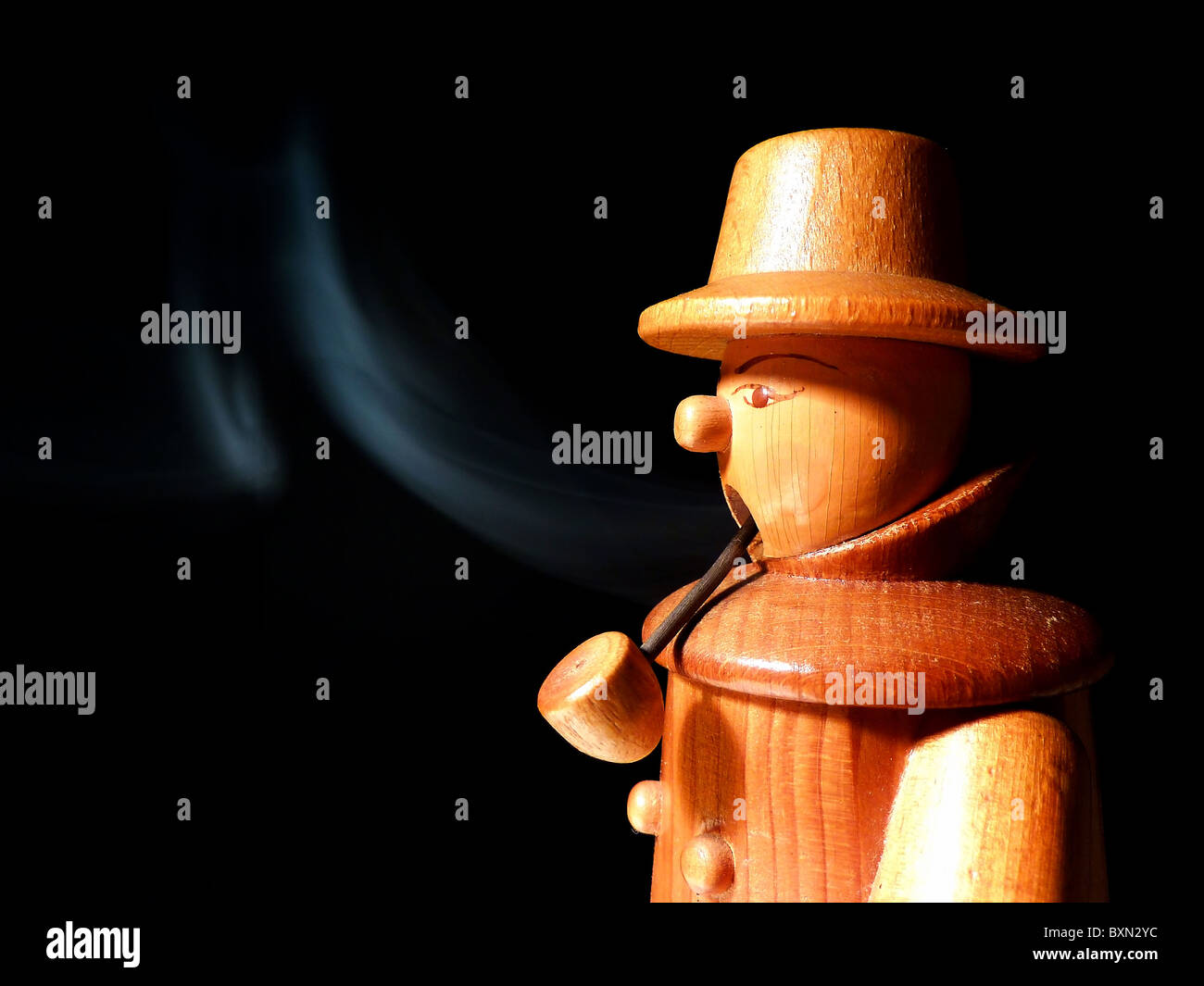 wooden toy with fuming pipe Stock Photo - Alamy