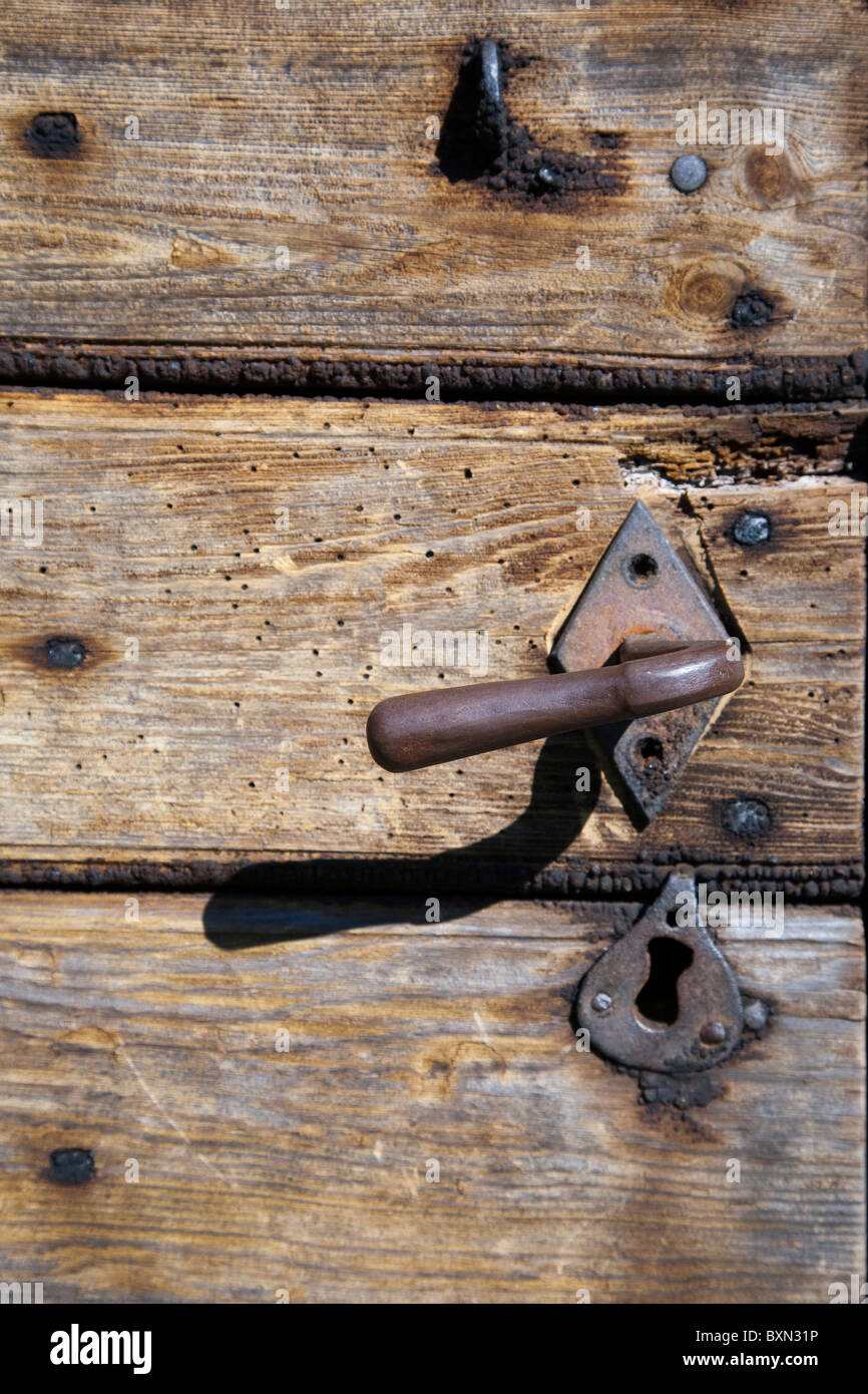 Old door handle and lock Stock Photo - Alamy