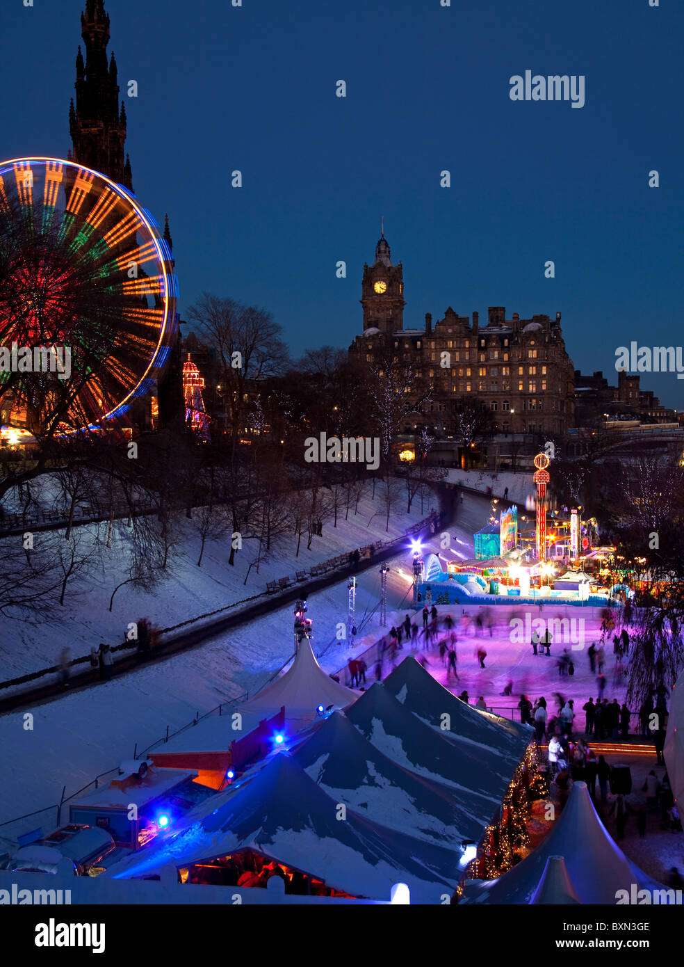 Edinburgh Ice Rink and big ferris wheel during winter festivities ...
