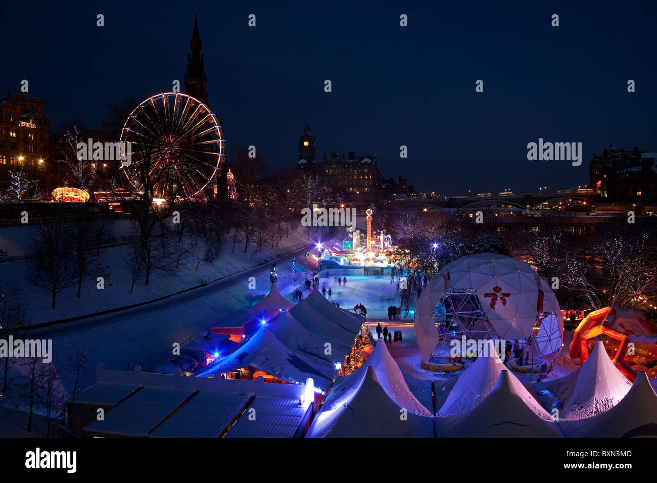 Edinburgh Ice Rink and big ferris wheel during winter festivities ...