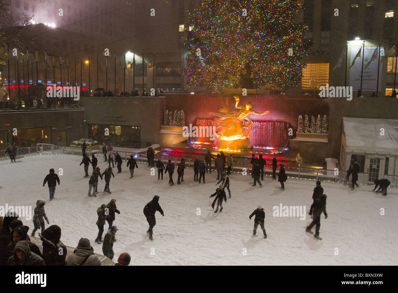 Skaters on a snow covered rink in Rockefeller Center during a blizzard ...