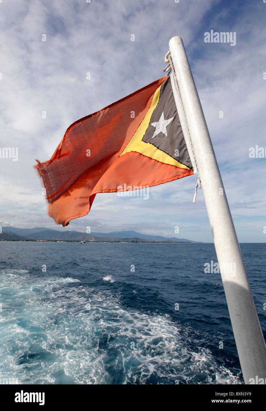 Flag of Timor Leste (East Timor) on the rear of a Ferry boat from Dili ...