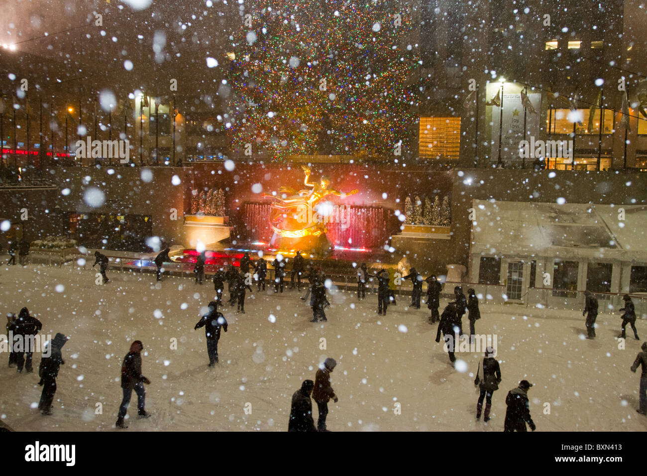 Skaters on a snow covered rink in Rockefeller Center during a blizzard ...