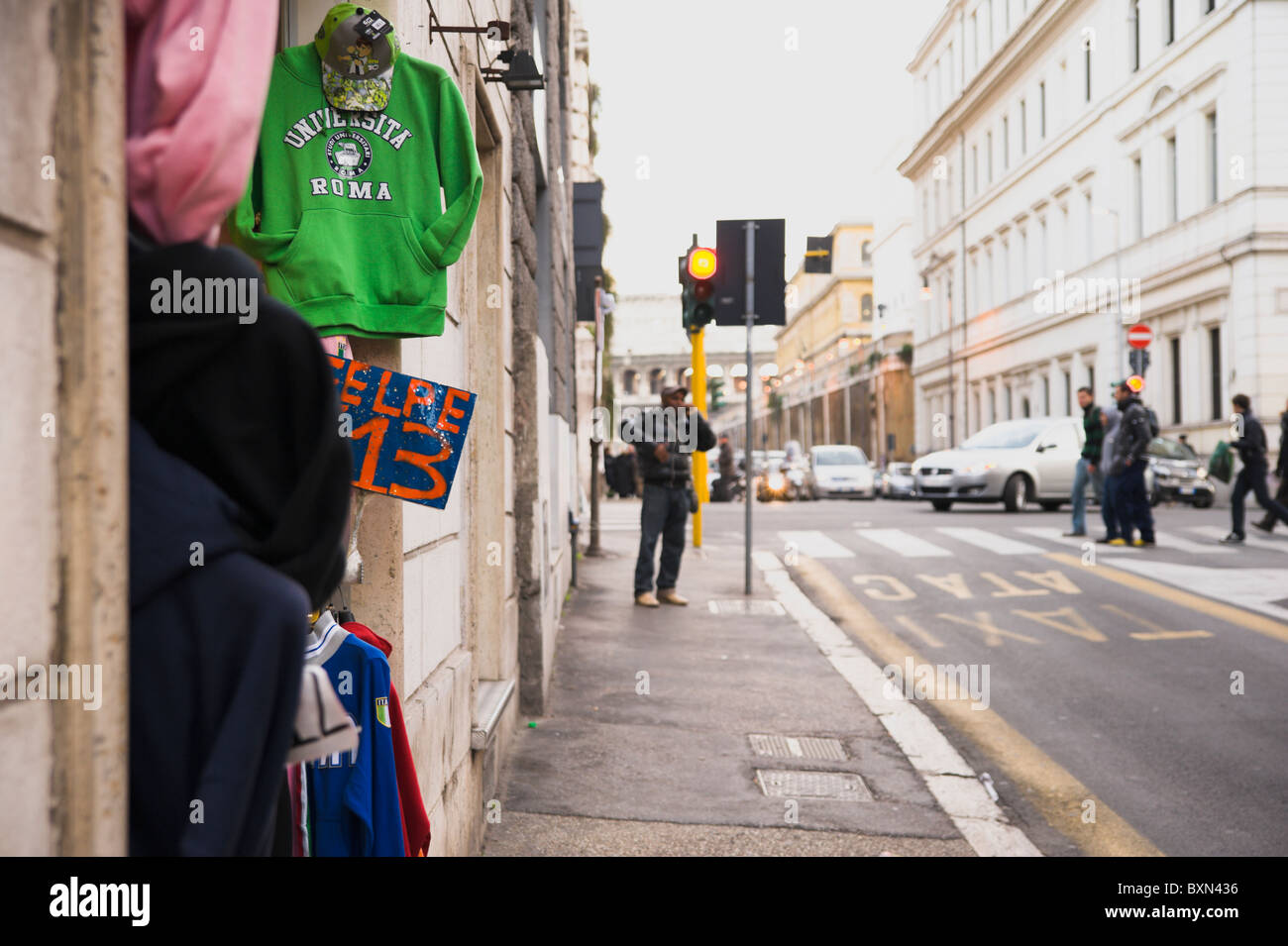 Rome, clothes shop, traffic light and passerbies Stock Photo - Alamy