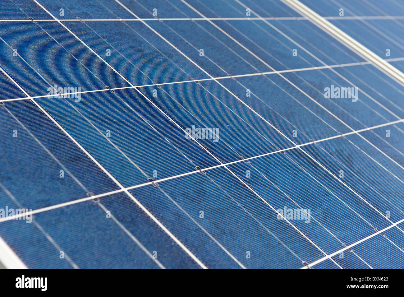Detail of photo-voltaic solar panels in an array in the UK Stock Photo ...
